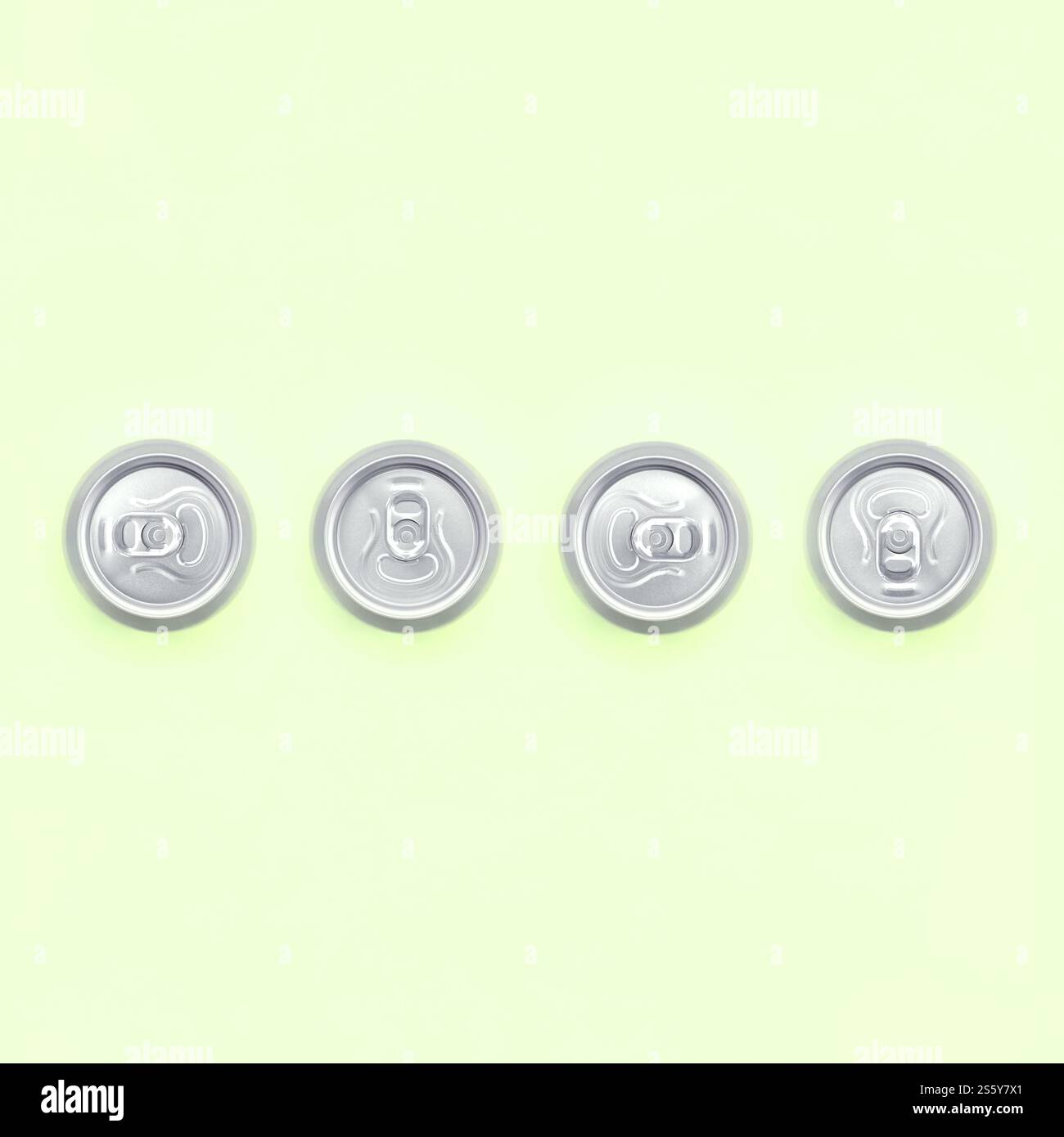 Many metallic beer cans on texture background of fashion pastel lime ...