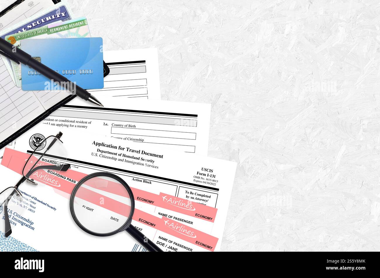 USCIS form I-131 Application for travel document lies on flat lay ...