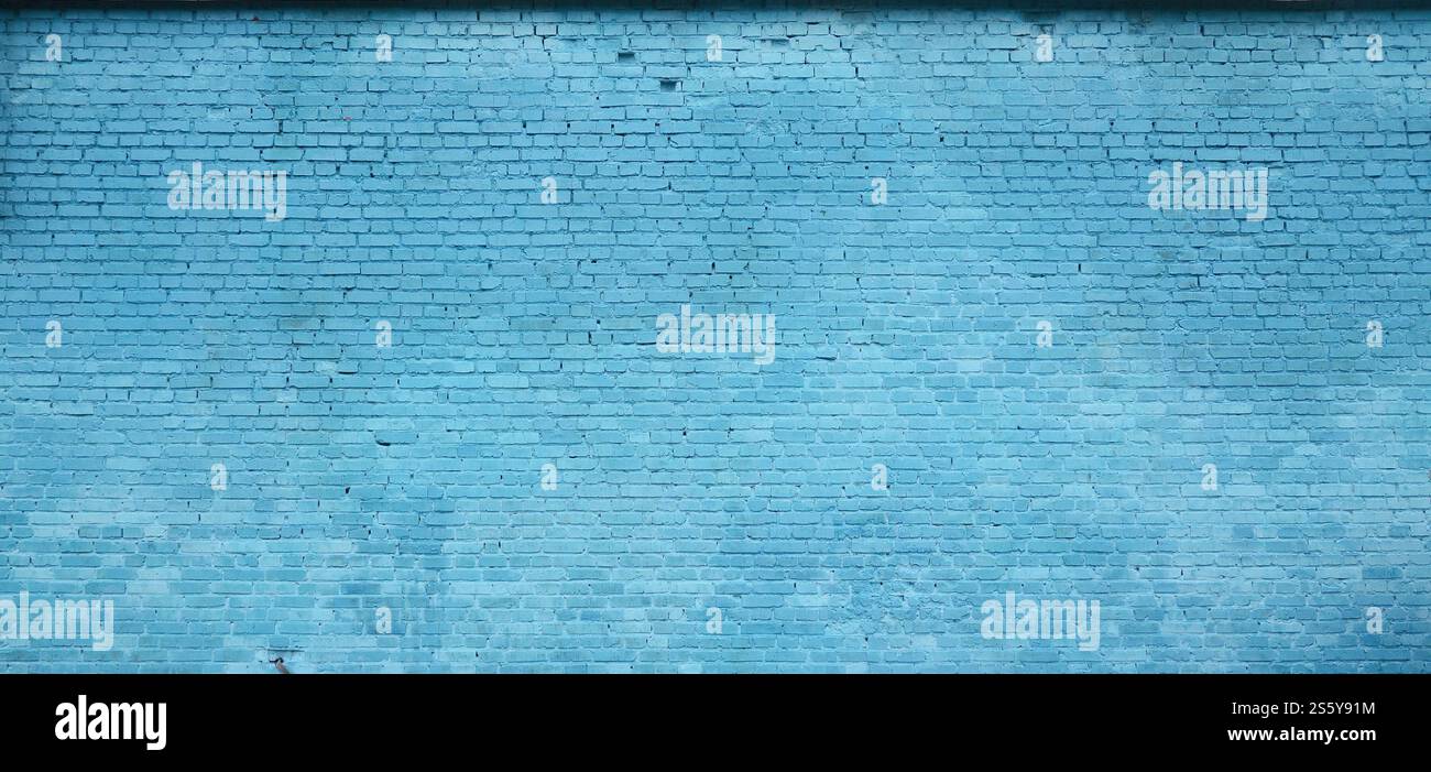 The texture of the brick wall of many rows of bricks painted in blue ...