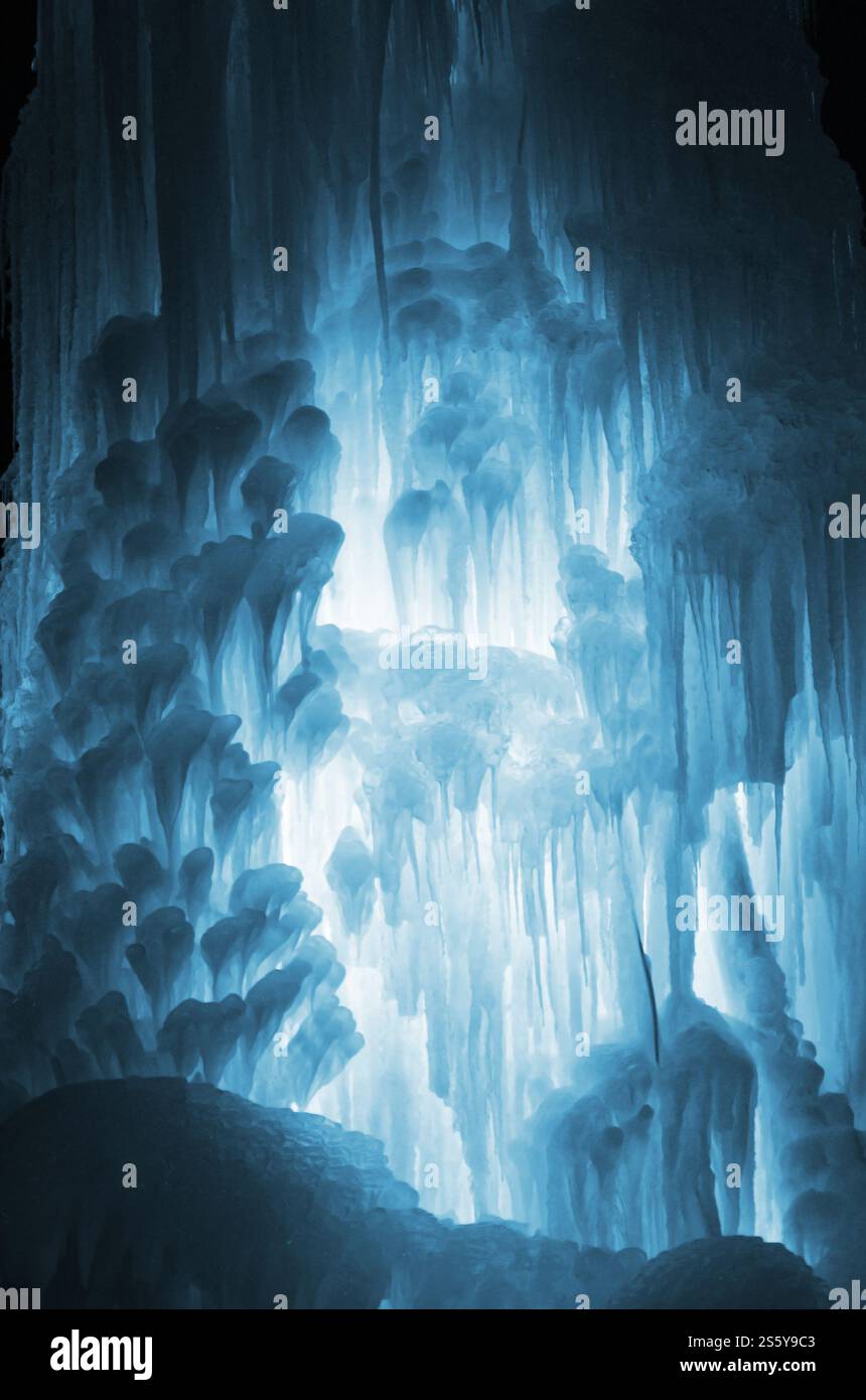 Huge ice icicles. Large blocks of ice frozen waterfall or water. Blue ...