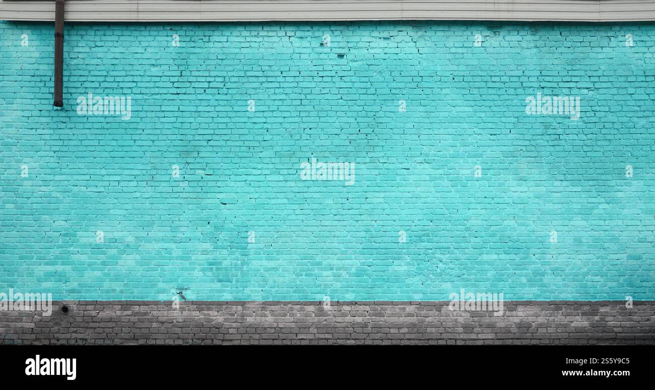The texture of the brick wall of many rows of bricks painted in cyan ...