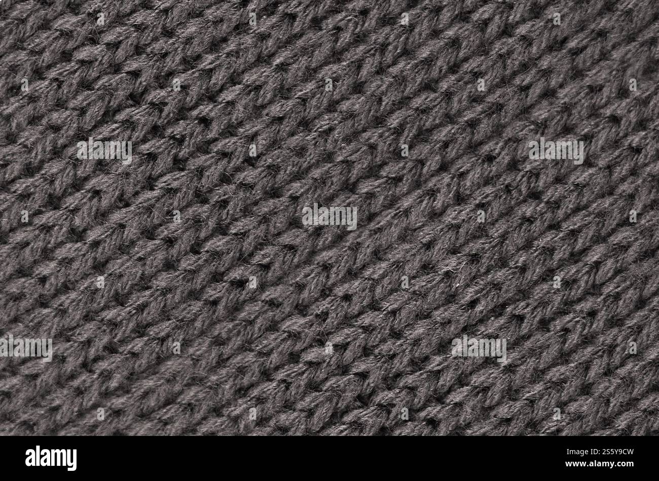 The texture of a knitted sweater wallpaper. Woolen fabric for wallpaper ...