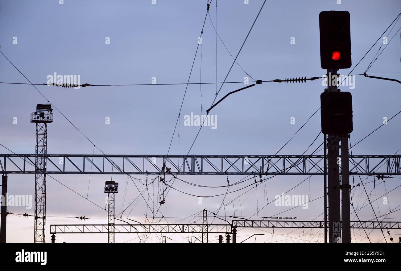 Railroad traffic light against clear blue sky, Contact wire. High ...