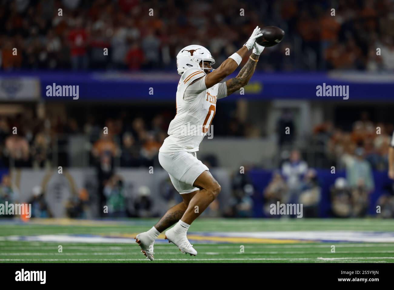 University of Texas wide receiver DeAndre Moore Jr. (0) catches a pass ...