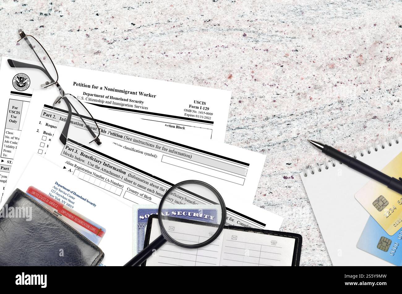 USCIS form I-129 Petition for a nonimmigrant worker lies on flat lay ...