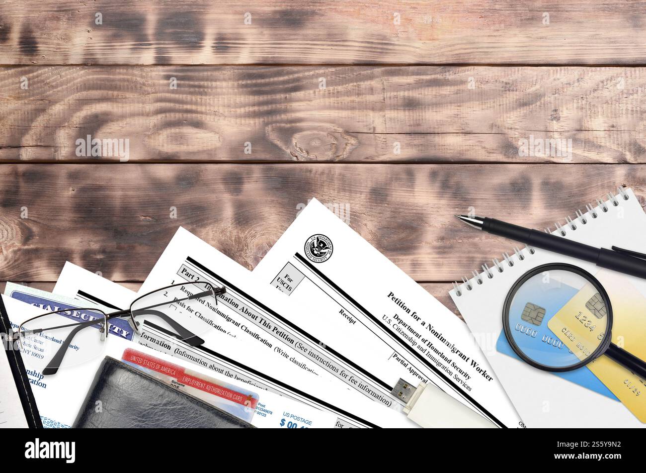 USCIS form I-129 Petition for a nonimmigrant worker lies on flat lay ...