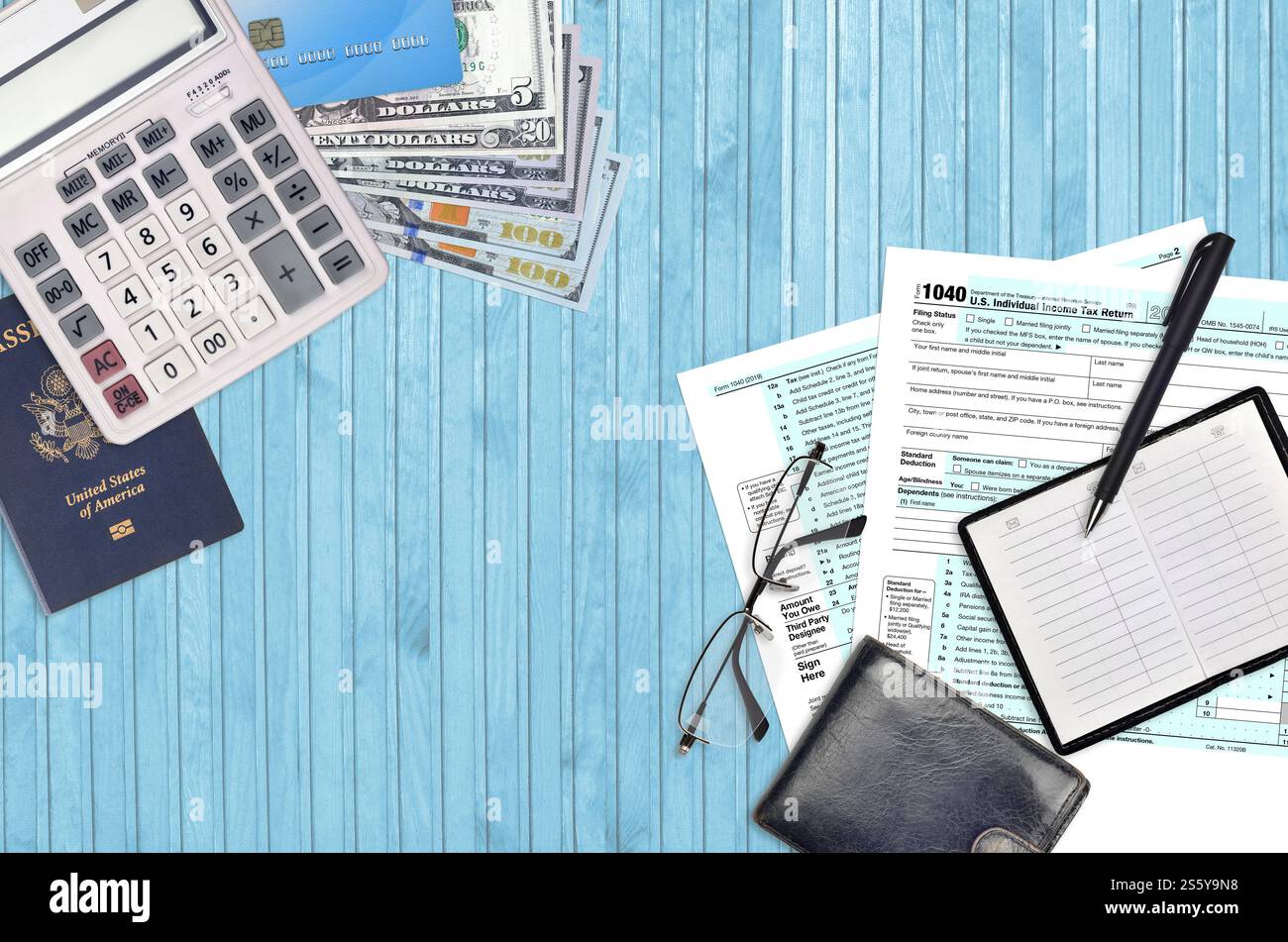 IRS form 1040 Individual income tax return lies on flat lay office ...