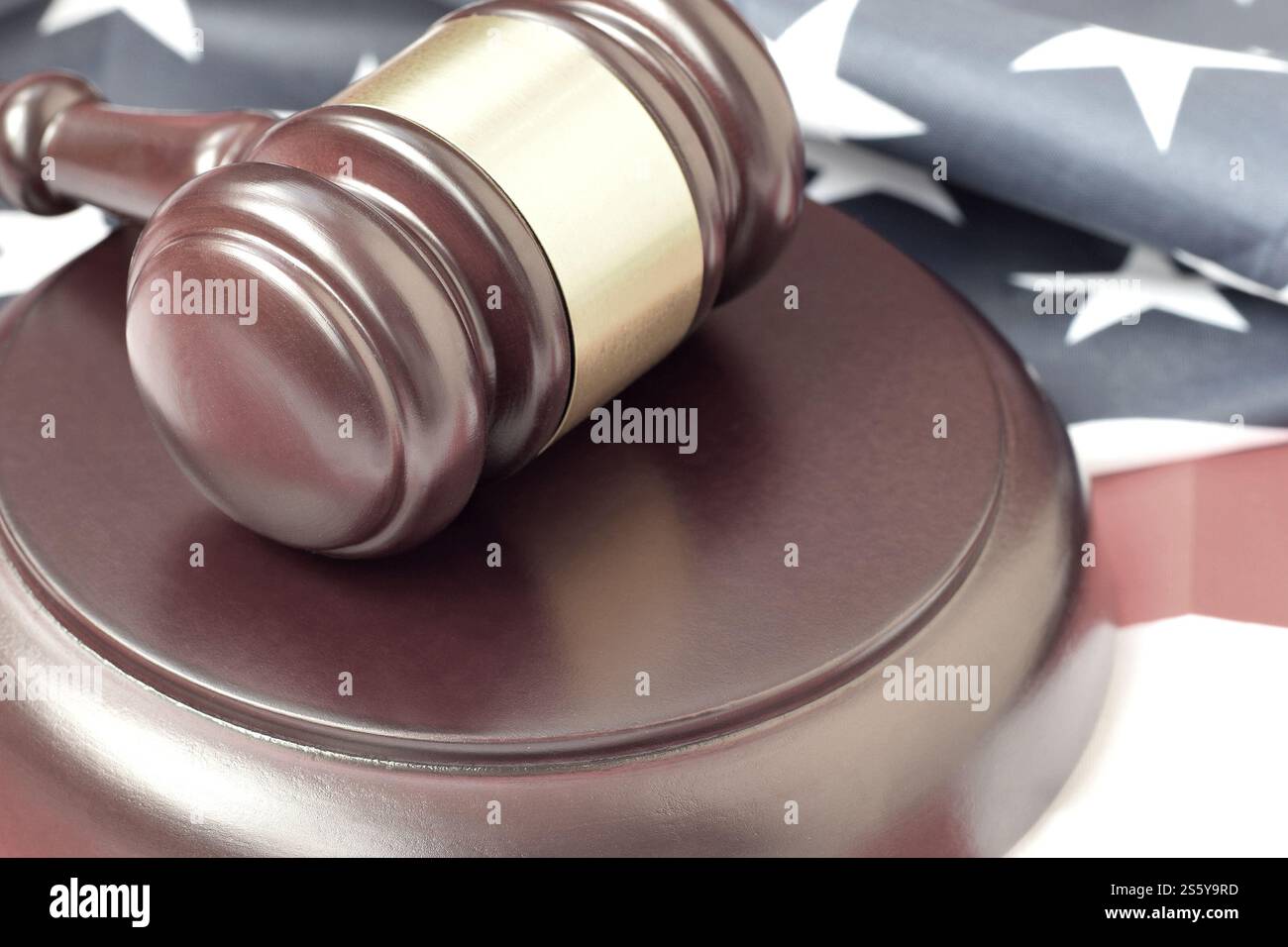 Justice mallet on United States flag in a courtroom during a judicial ...