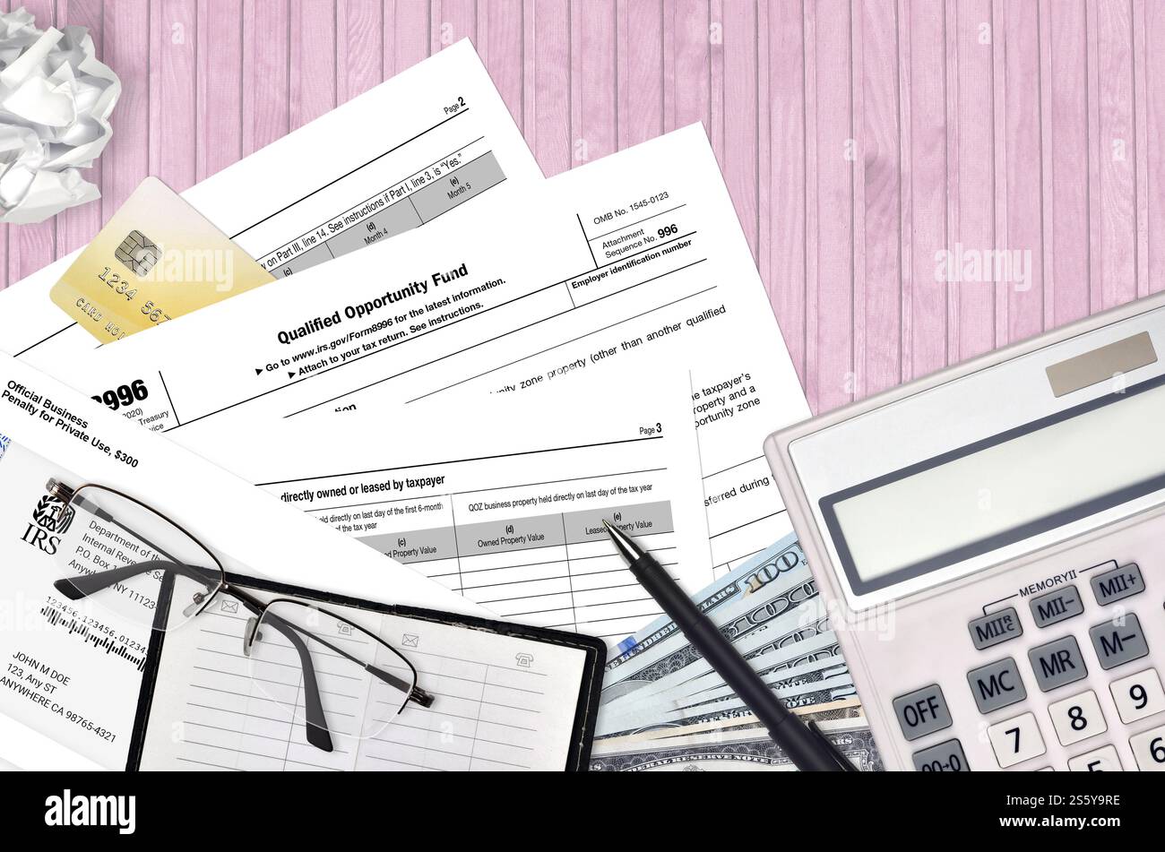 IRS form 8996 Qualified opportunity fund lies on flat lay office table ...