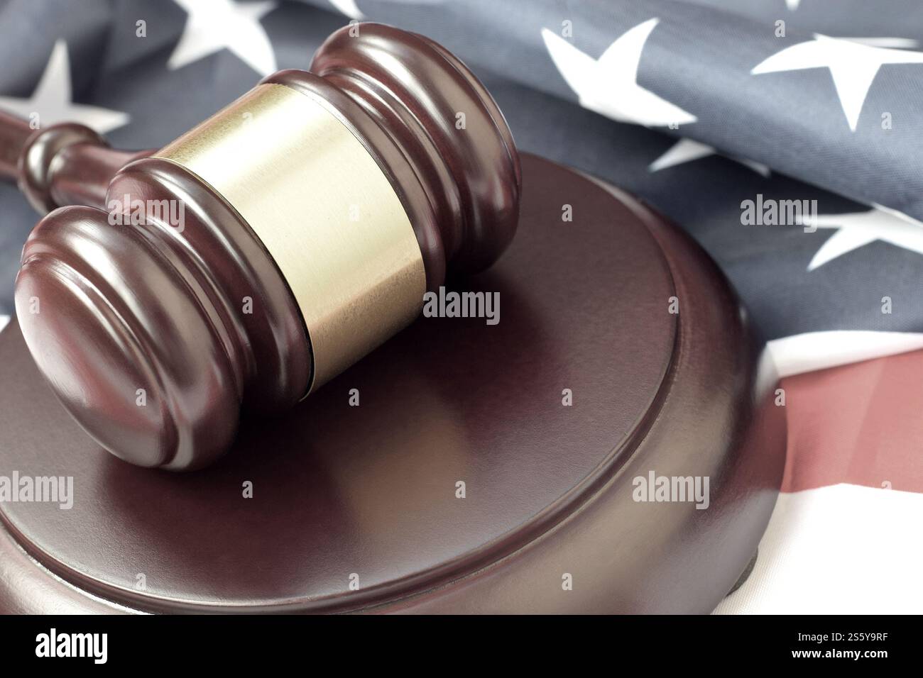 Justice mallet on United States flag in a courtroom during a judicial ...