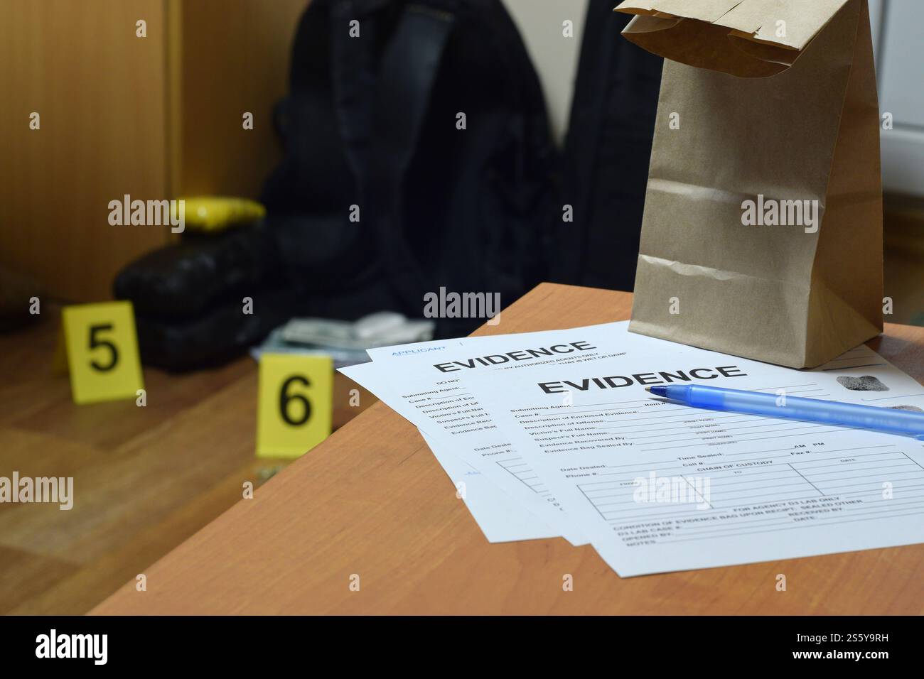 Evidence Chain of Custody Labels and brown paper bag lies with big ...