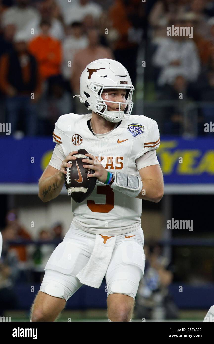 Texas quarterback Quinn Ewers (3) looks to pass during the Cotton Bowl ...