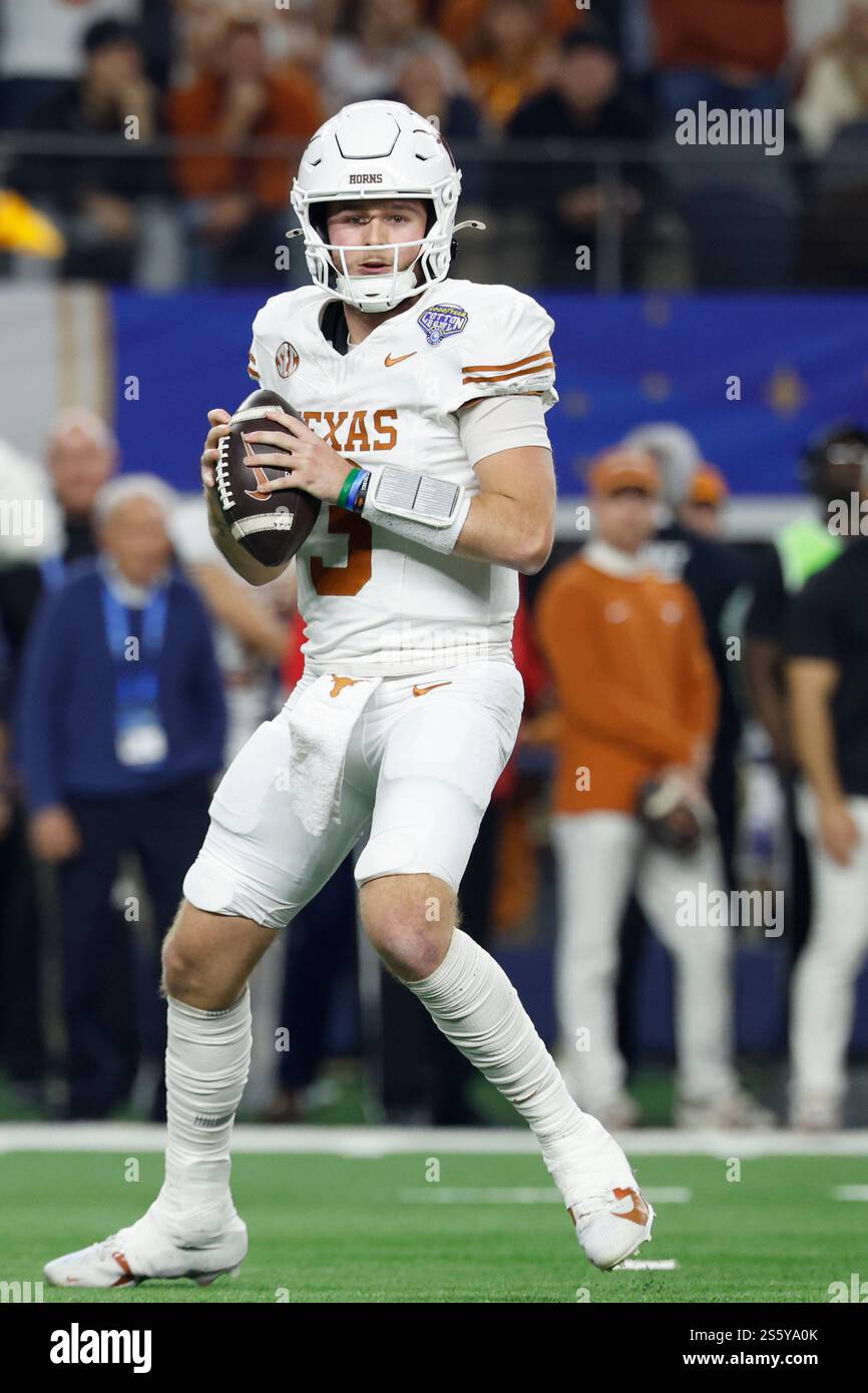 Texas quarterback Quinn Ewers (3) looks to pass during the Cotton Bowl ...