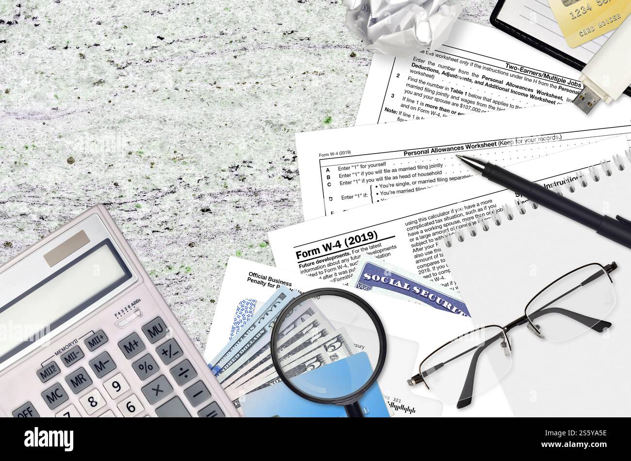 IRS form w-4 Employees Withholding Certificate lies on flat lay office ...