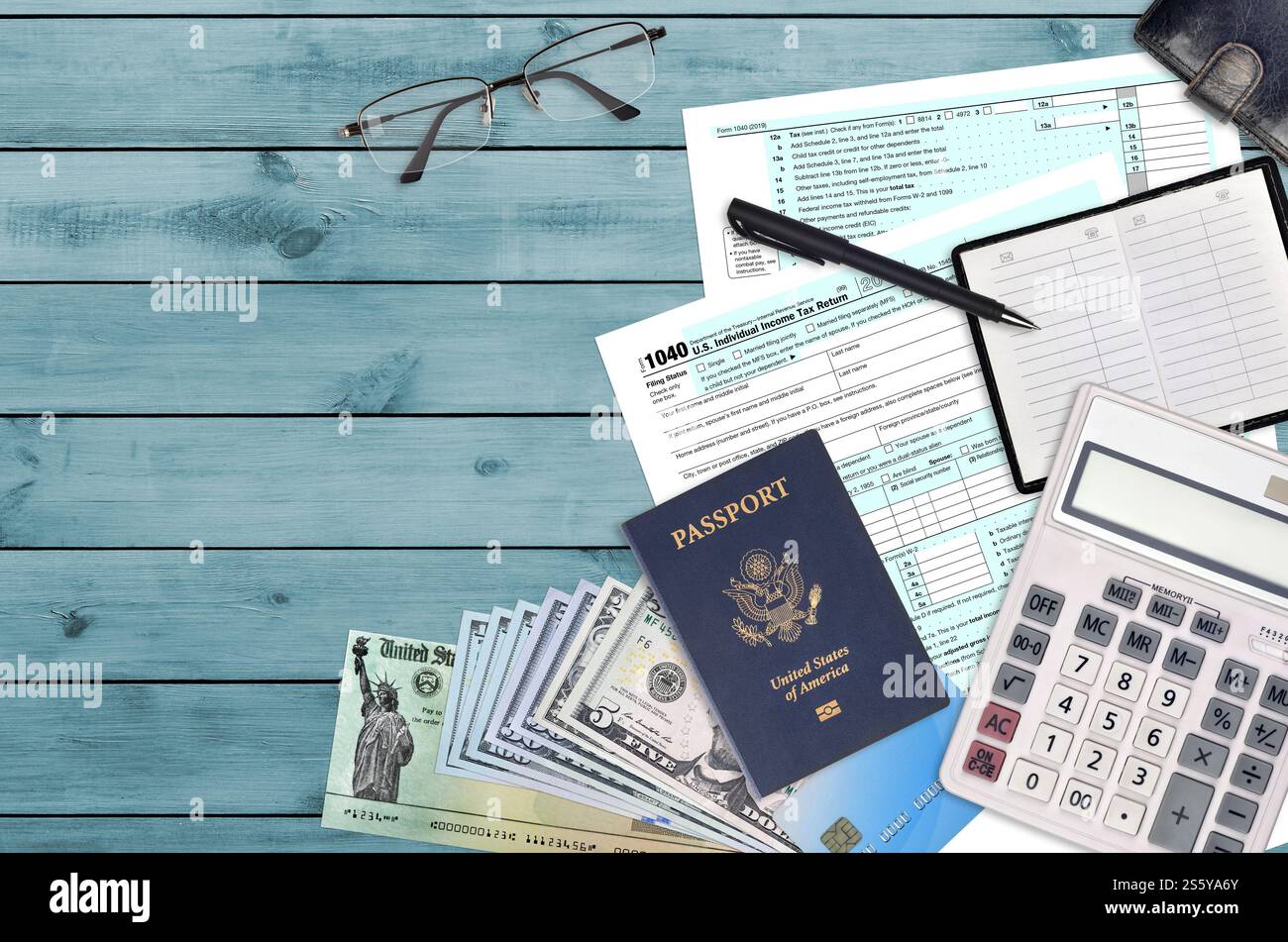 IRS form 1040 U.S. Individual income tax return with refund check lies ...