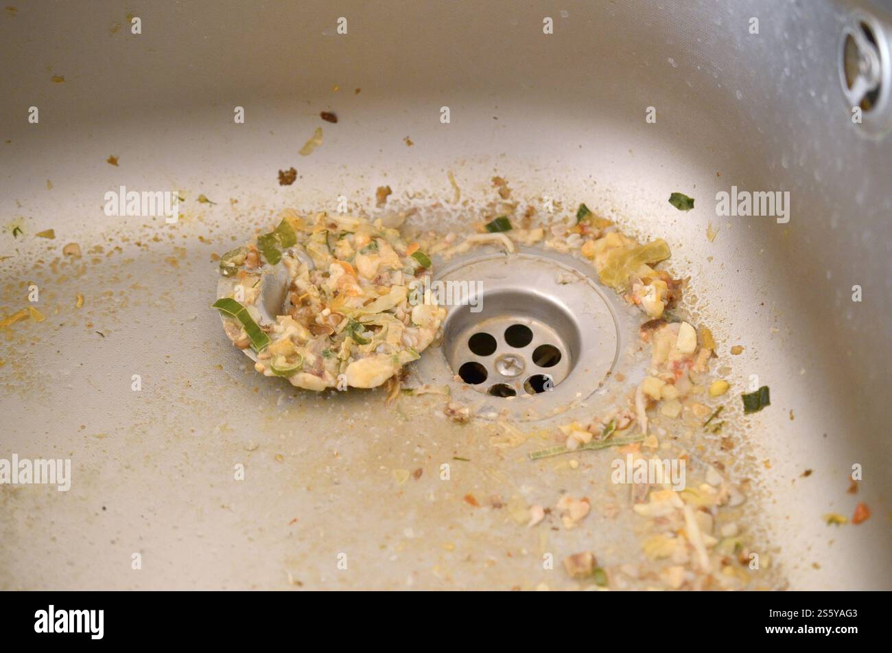 Close up on dirty clogging kitchen sink drain. Blur and selective focus ...