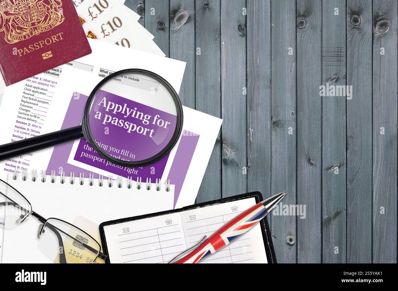 English violet guide Applying for a passport lies on table with office ...