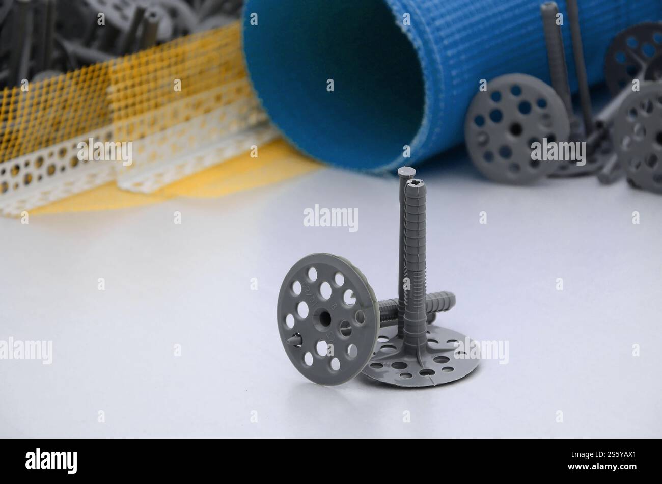 A set of construction items for the insulation of walls. Plastic dowels ...