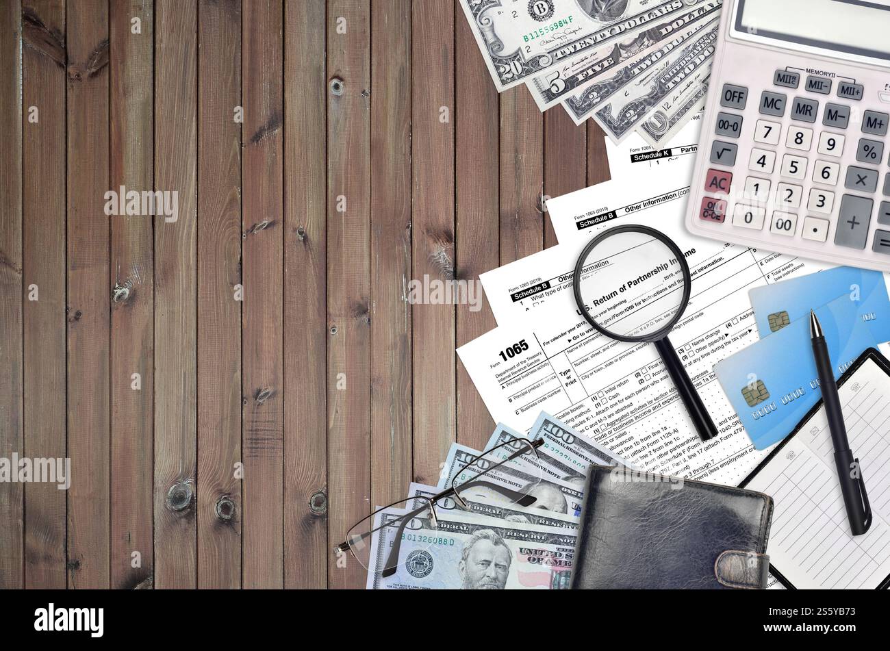 IRS form 1065 U.S. Return of partnership income lies on flat lay office ...