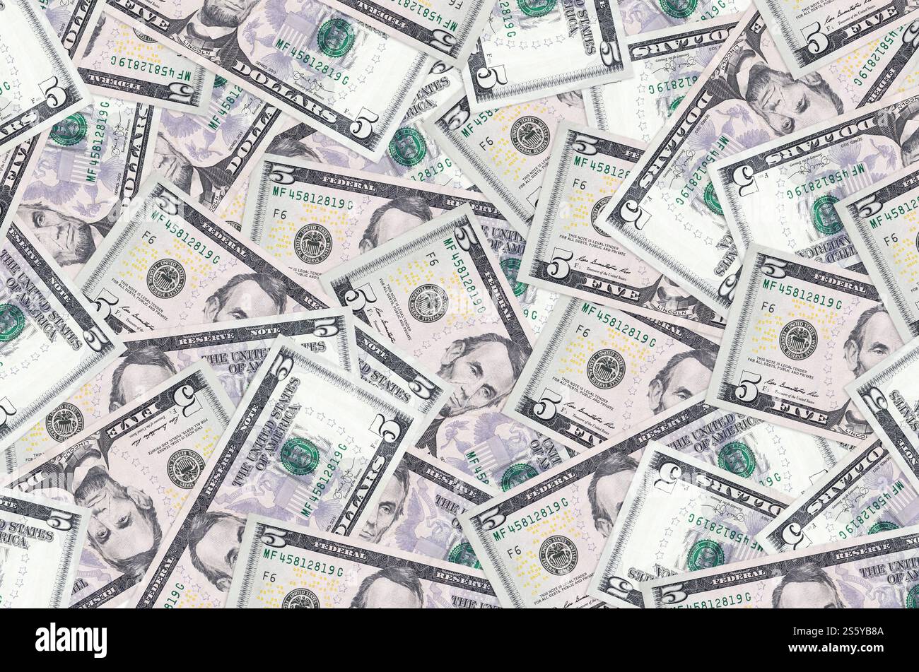 5 US dollars bills lies in big pile. Rich life conceptual background ...