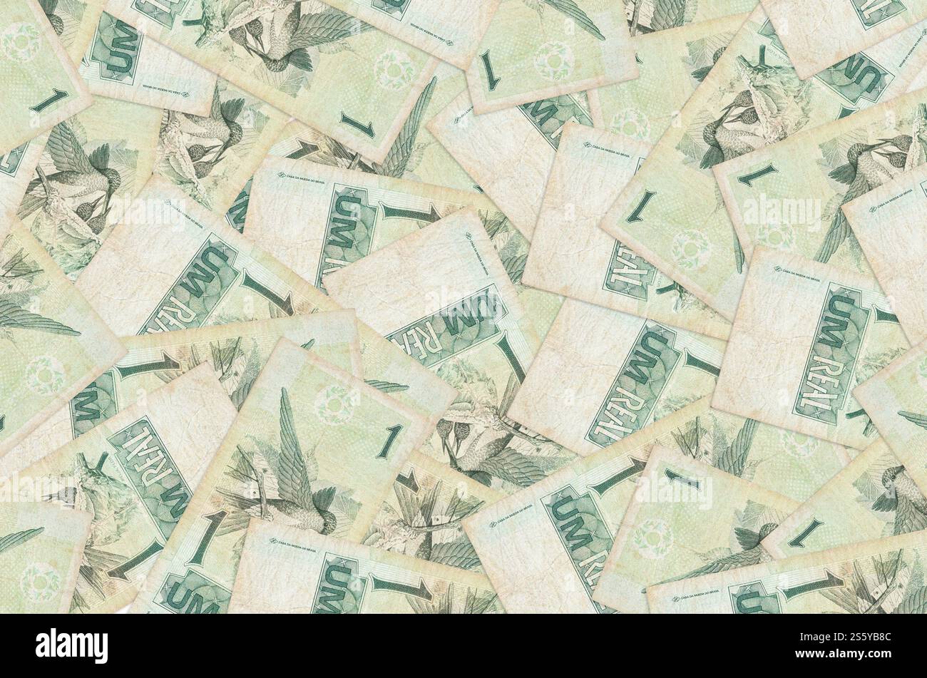 1 Brazilian real bills lies in big pile. Rich life conceptual ...