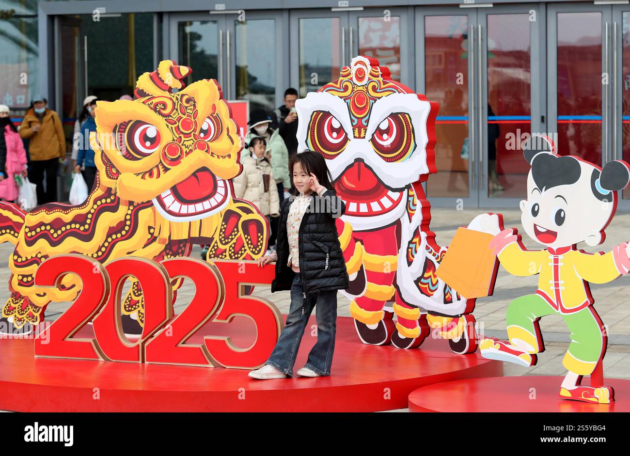 People visit a Spring Festival goods fair in Kunming City, southwest ...
