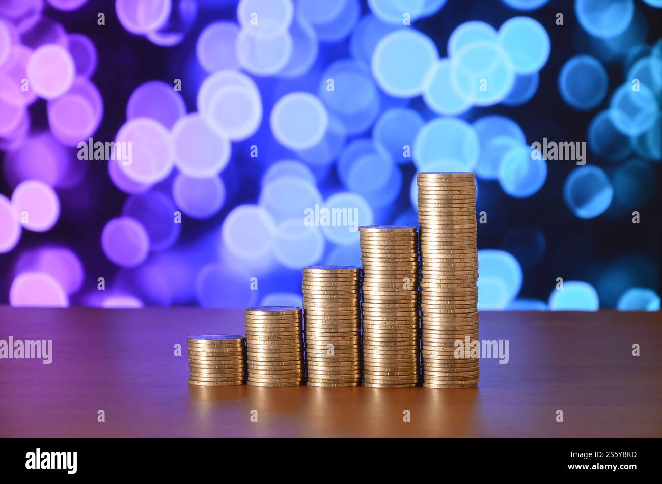 Golden coin stacks arranged as a graph. Increasing columns of coins ...