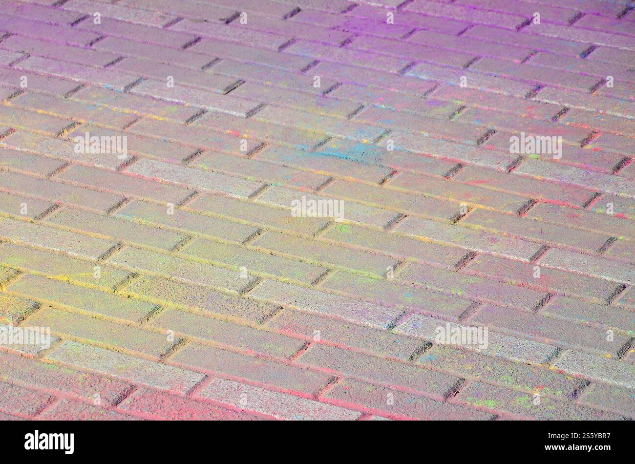 Multi colored earth, paving slabs, powder coated with dry colors at the Holi festival close up ...