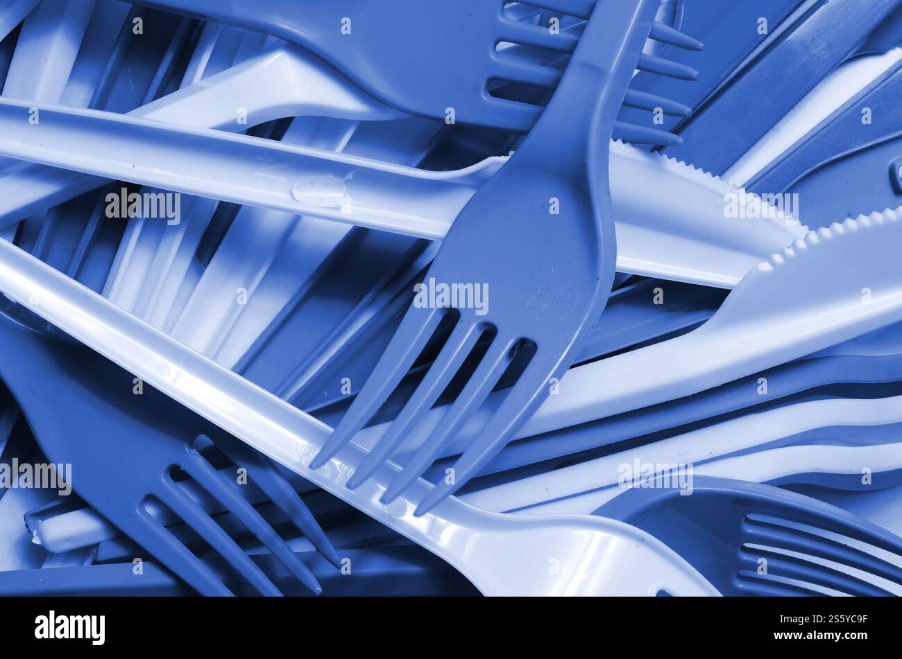 Pile of phantom classic blue color used plastic kitchenware appliances ...