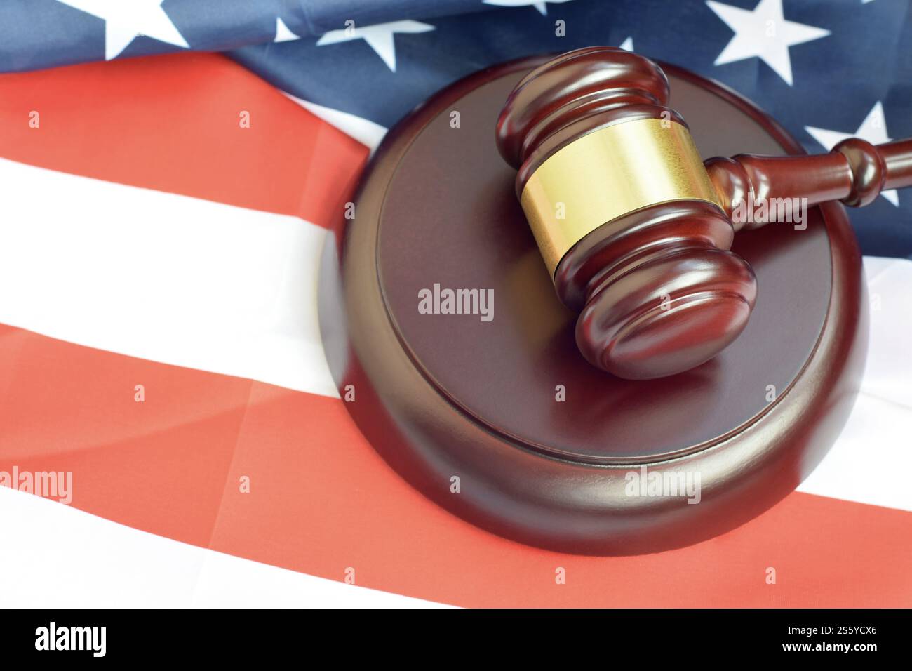 Justice mallet on United States flag in a courtroom during a judicial ...