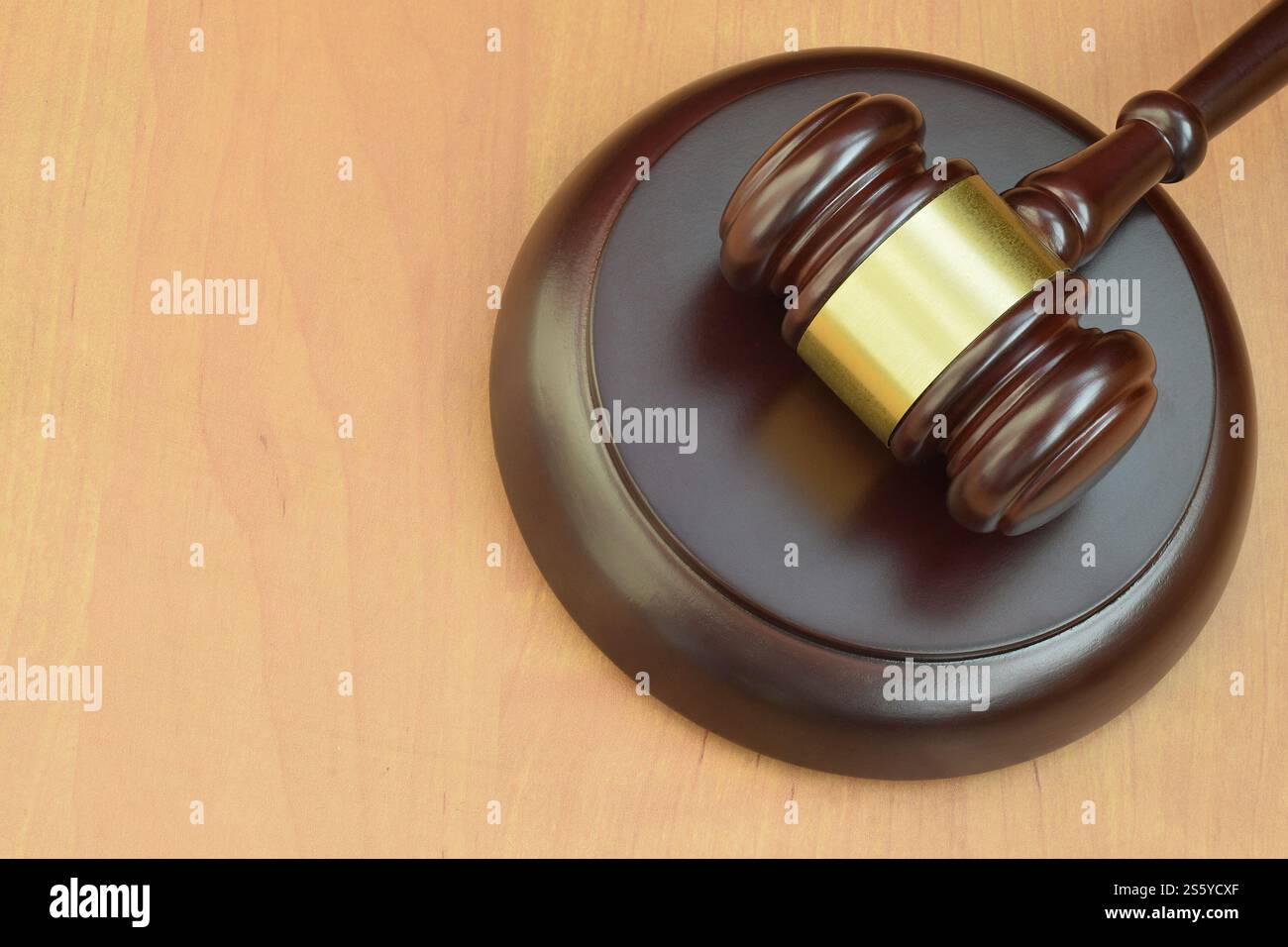 Justice mallet on wooden desk in a courtroom during a judicial trial. Law concept and empty copy ...