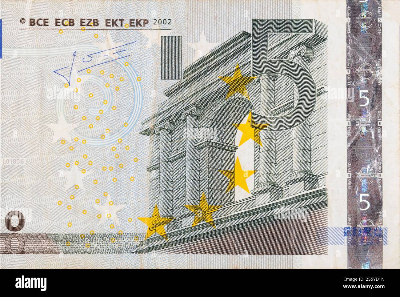 Fragment part of 5 euro banknote close-up with small brown details ...