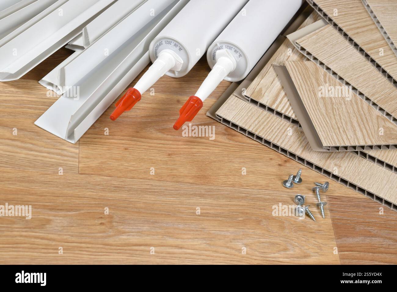 Set of items for PVC ceiling indoor works. Assembly adhesive bottles ...