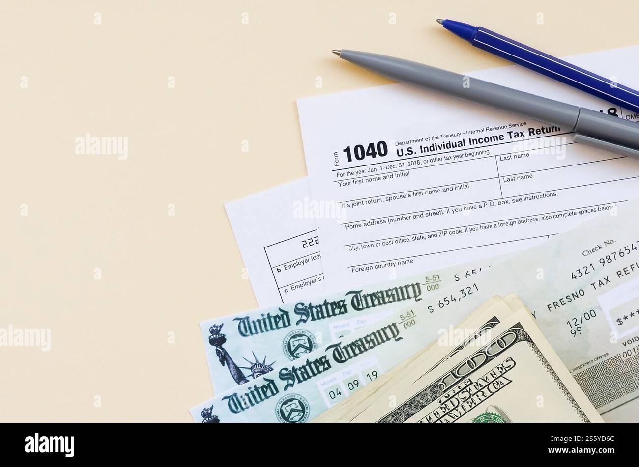 1040 Individual Income tax return form with Refund Check and hundred ...