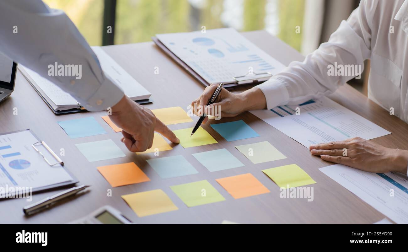 Business People brainstorming Meeting Design Ideas use post it notes to ...