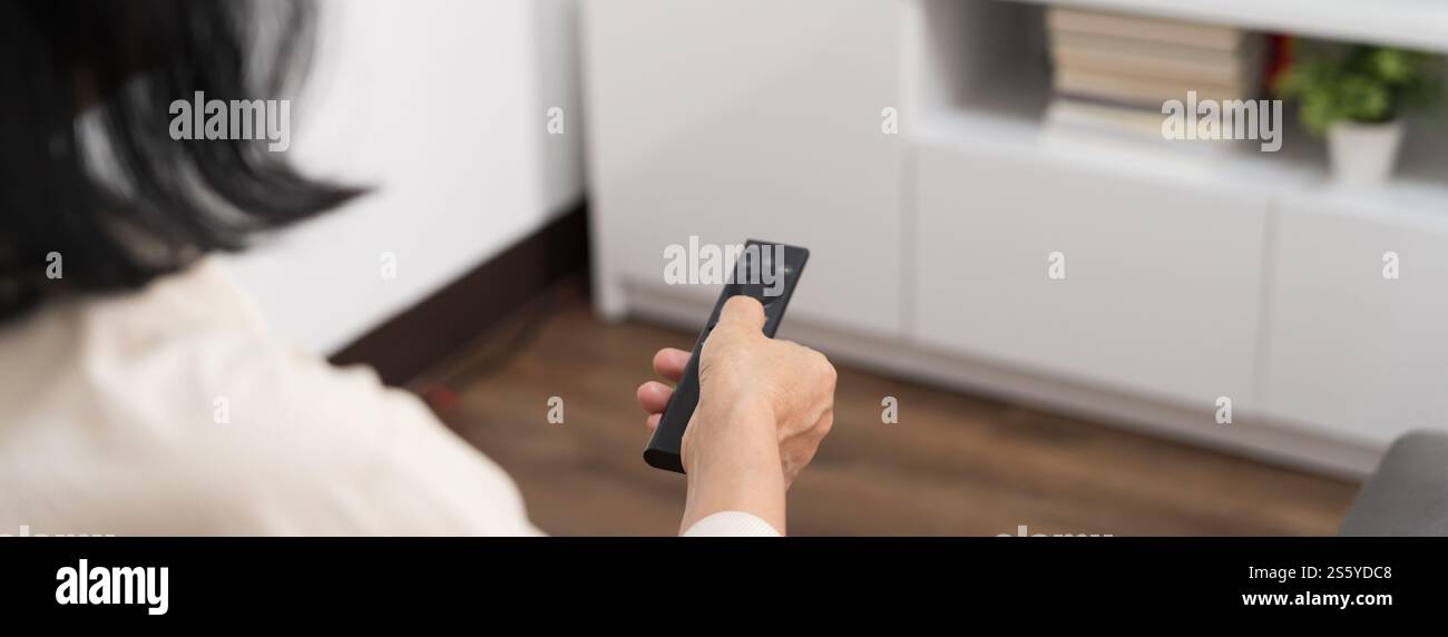 Elderly woman Watching smart TV and using remote controller Hand ...