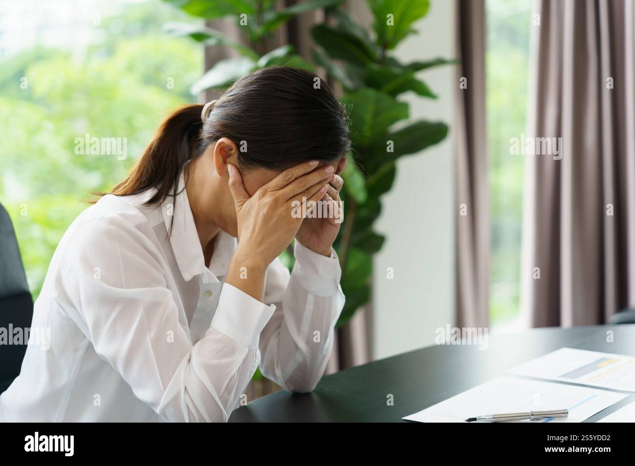Burnout concept. Asian Business woman touching forehead having headache ...