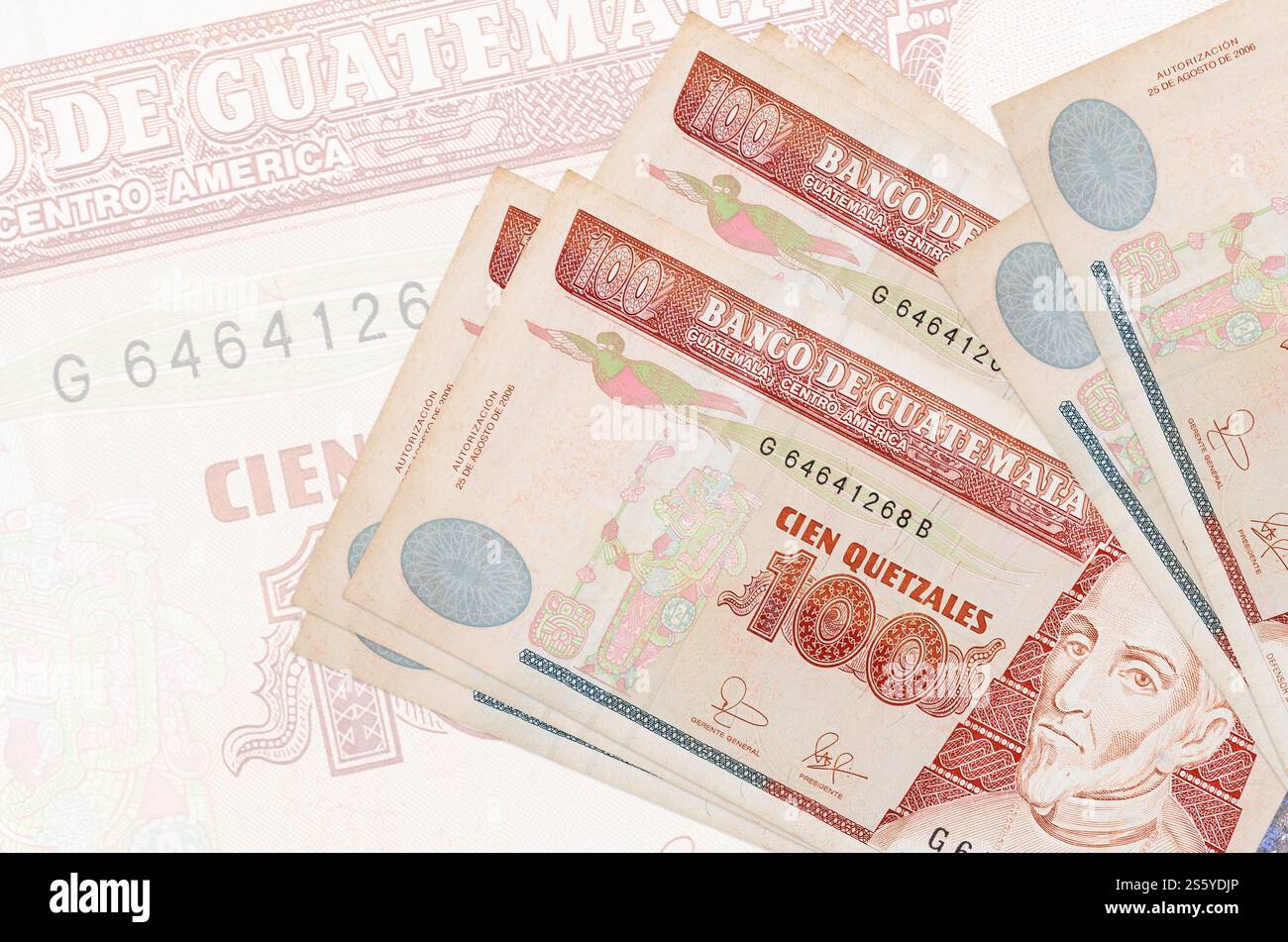 100 Guatemalan quetzales bills lies in stack on background of big semi ...