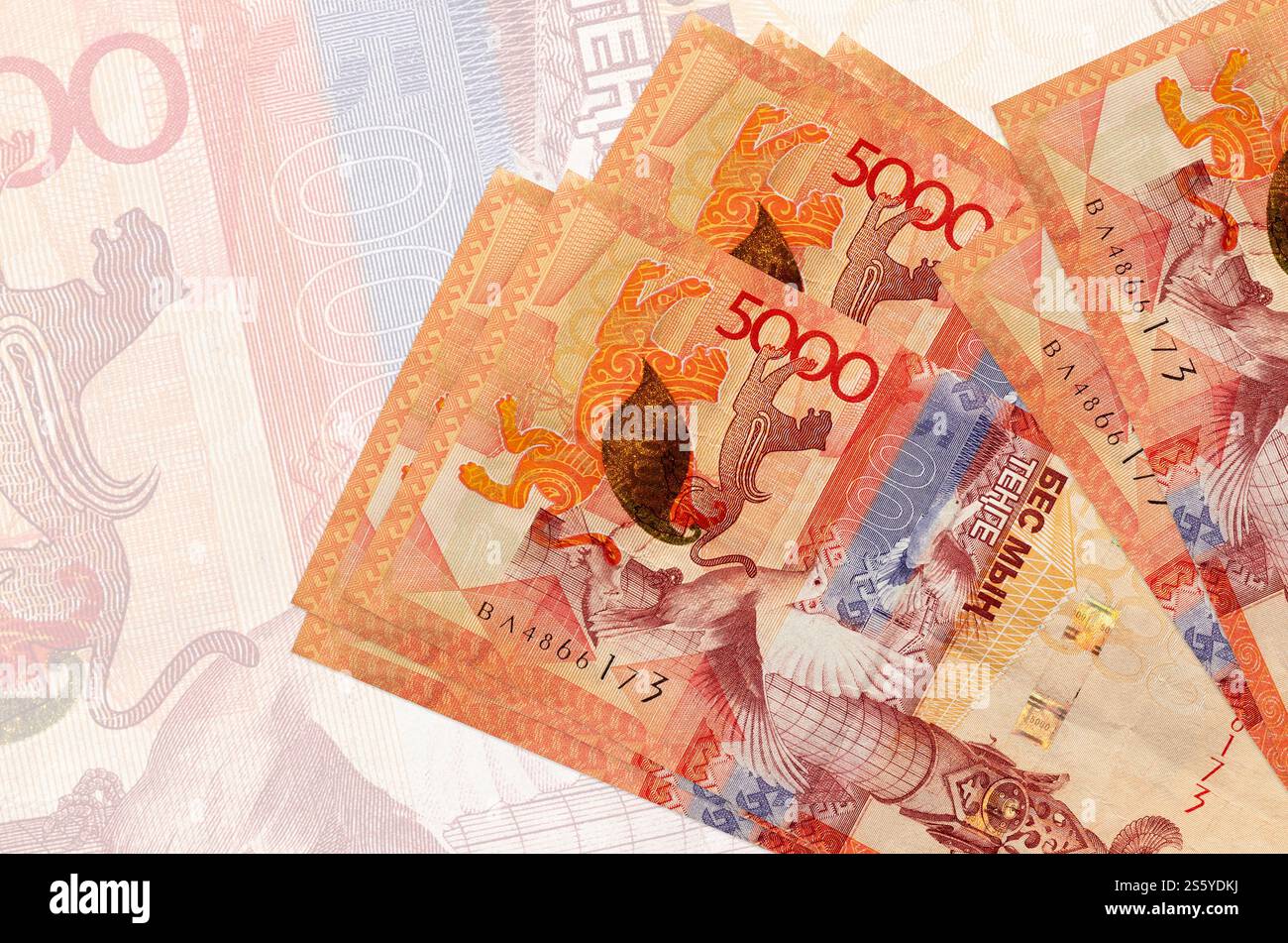 5000 Kazakhstani tenge bills lies in stack on background of big semi ...