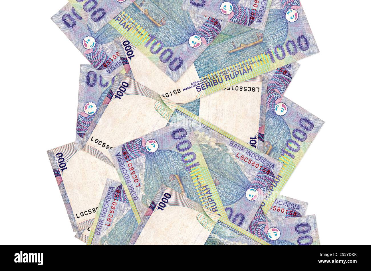 1000 Indonesian rupiah bills flying down isolated on white. Many ...