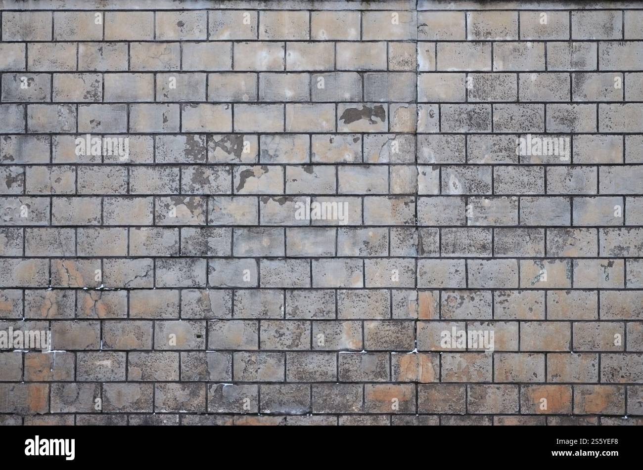 Weathered stained old block wall background. Texture of an old wall of ...