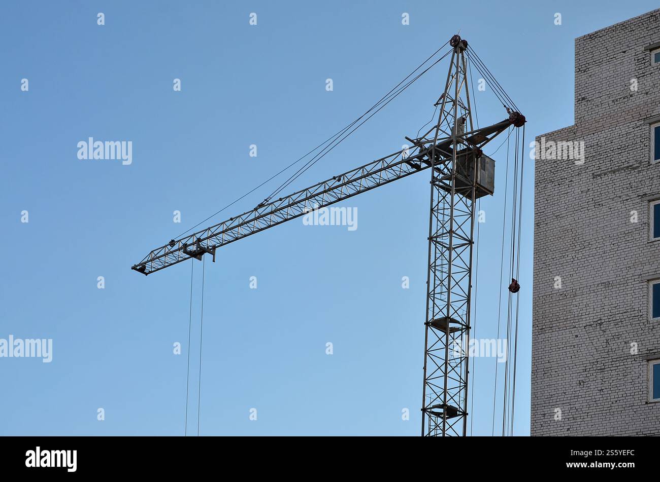 Working tall cranes inside place for with tall buildings under ...