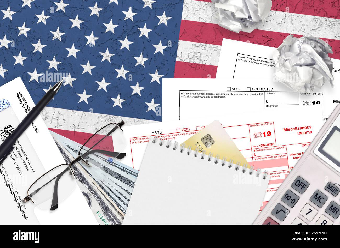 IRS form 1099-MISC Miscellaneous income lies on flat lay office table ...