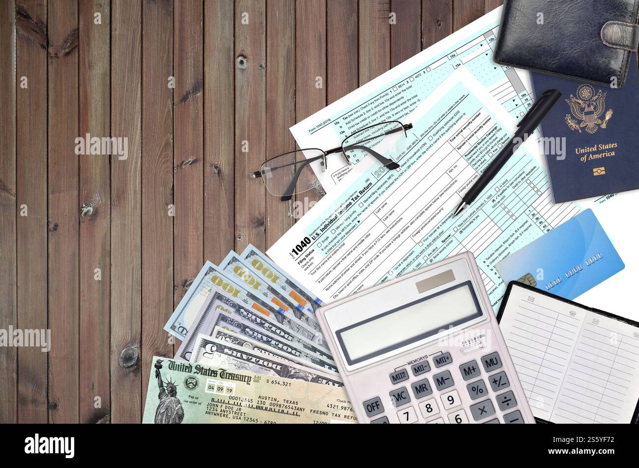 IRS form 1040 U.S. Individual income tax return with refund check lies ...