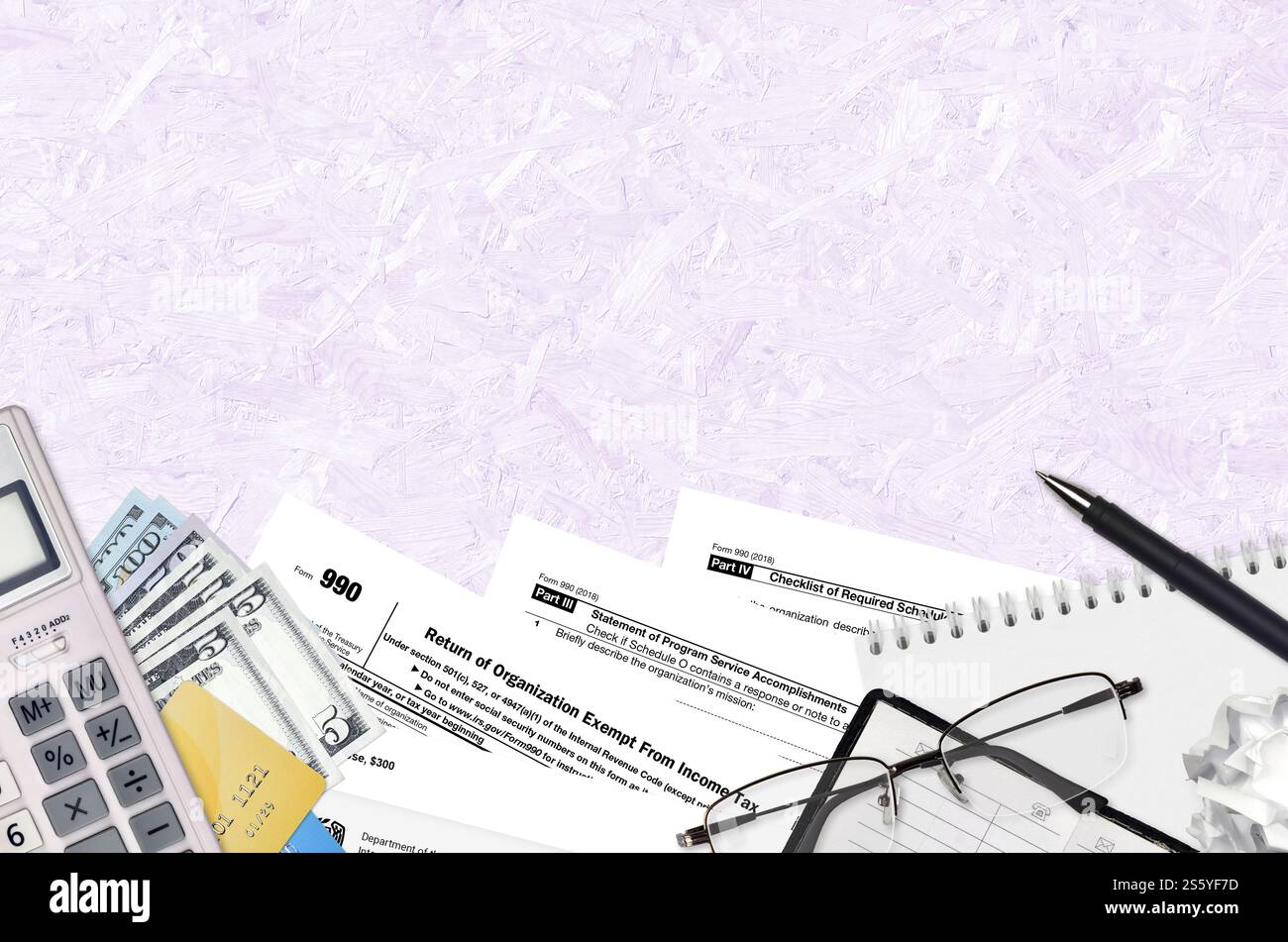 IRS form 990 Return of organization exempt from income tax lies on flat ...