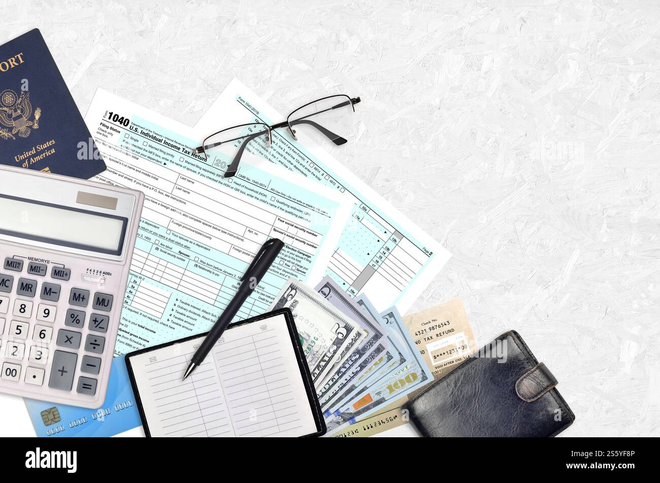 IRS form 1040 U.S. Individual income tax return with refund check lies ...