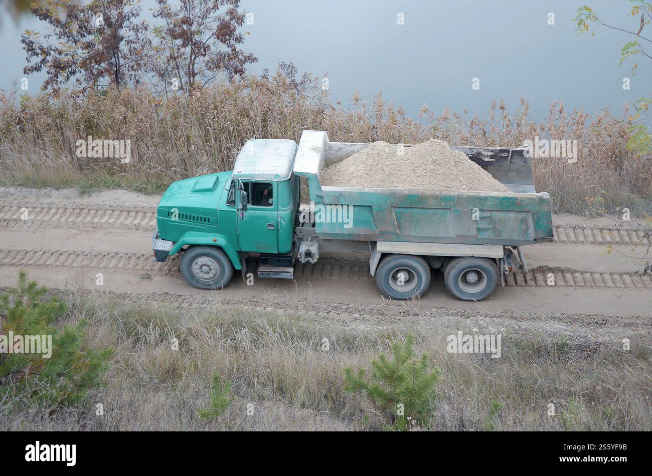 Dump truck transports sand and other minerals in the mining quarry ...