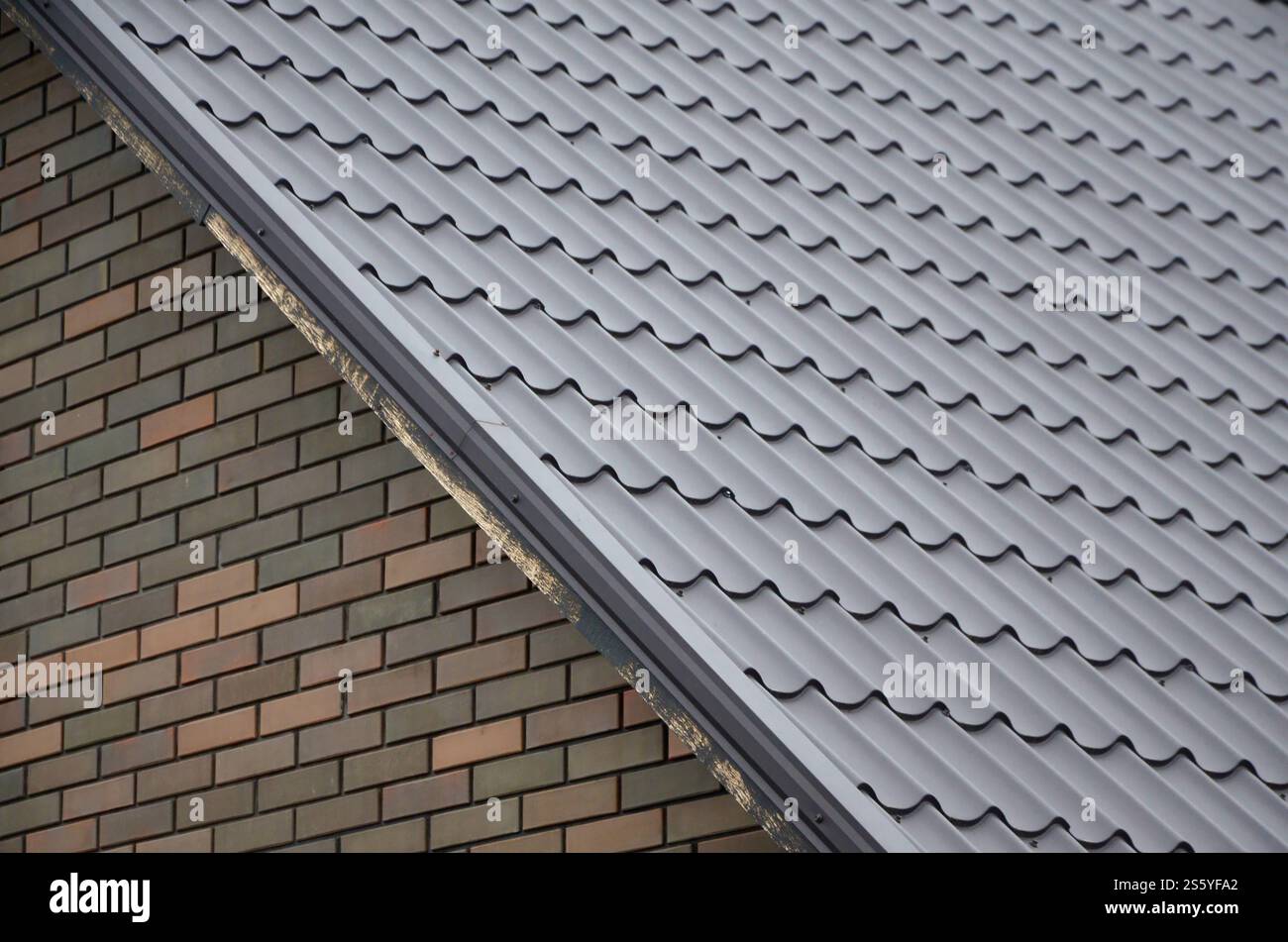 Modern brown roof made of painted metal. Corrugated metal roof and ...