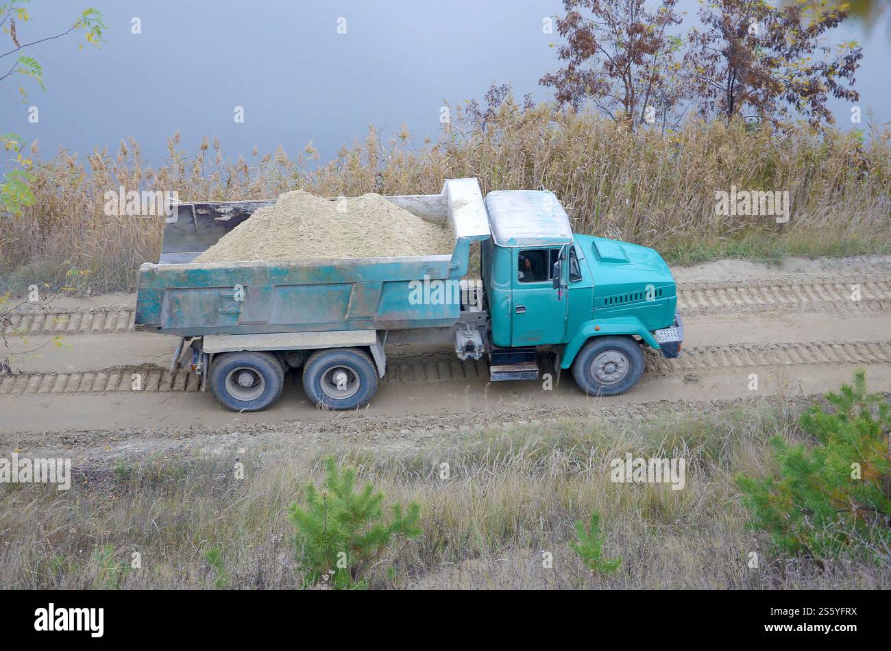 Dump truck transports sand and other minerals in the mining quarry ...