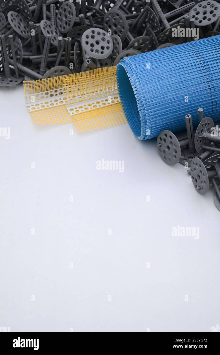 A set of construction items for the insulation of walls. Plastic dowels ...